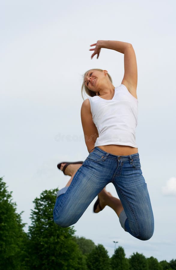 Happy jumping woman. stock photo. Image of cool, people - 5628632