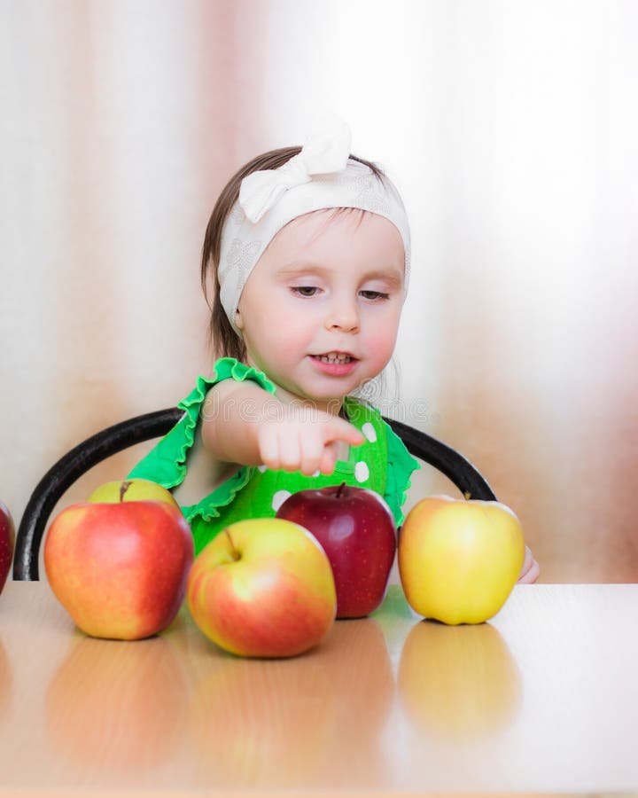 Happy Kid with apples. stock image. Image of eating, expression - 31861903