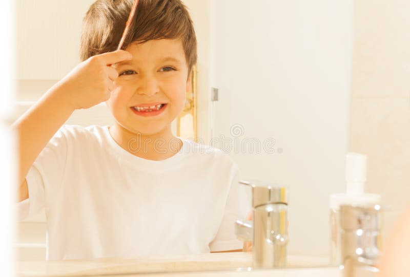 Happy Kid Boy Combing His Hair in the Morning Stock Photo - Image of ...