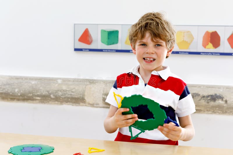 Happy Kid Boy Having Fun with Building and Creating Geometric Figures ...