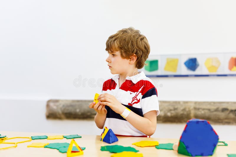 Happy Kid Boy Having Fun with Building and Creating Geometric Figures ...