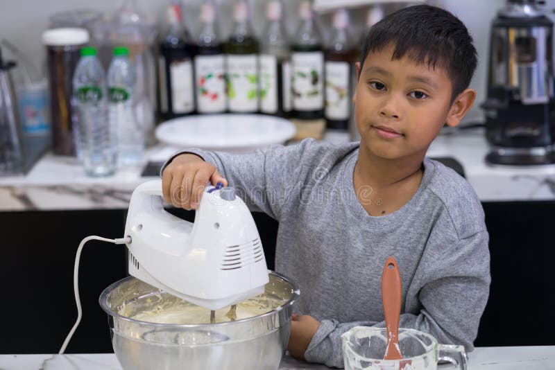 Happy Kid Boy Making a Cake Stock Image - Image of home, chef: 143880149