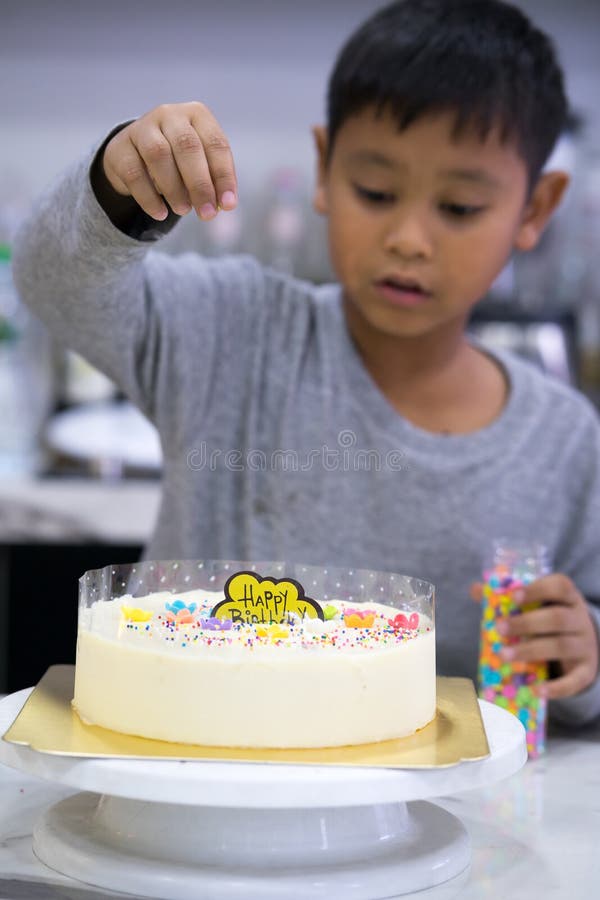 Happy Kid Boy Making a Cake Stock Photo - Image of sweet, childhood ...