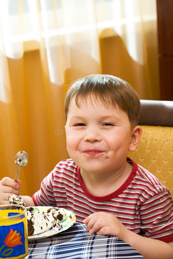 Young Boy Eating Chocolate Cake in Cafe Stock Image - Image of glass ...