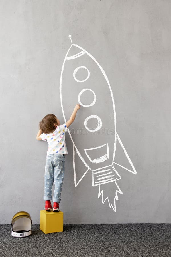 Happy Kid Draws a Chalk Rocket on the Wall Stock Image - Image of ...