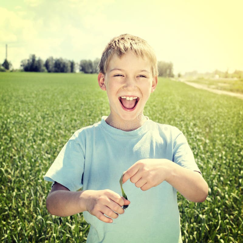 Happy Kid in the Field stock photo. Image of happy, positivity - 58718974