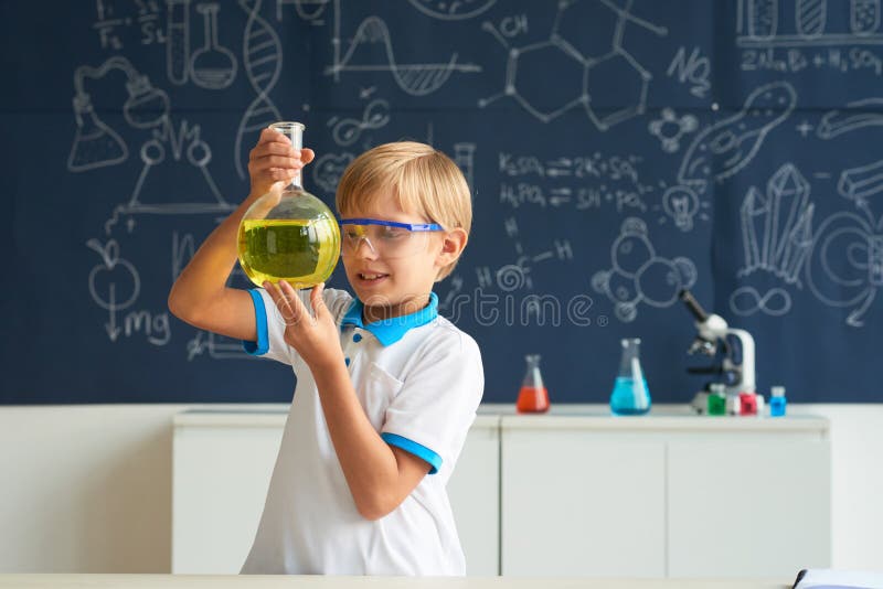 Boy in chemistry class stock photo. Image of flask, education - 111047210