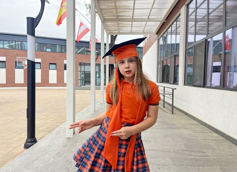 Happy Kid in a Graduation Cap and School Uniform Having Fun on School ...