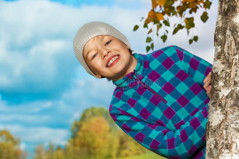 Happy Kid Jumping Out of Tree Stock Image - Image of field, caucasian ...