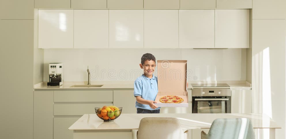 Happy Kid in a Kitchen Holding Pizza Stock Photo - Image of meal ...