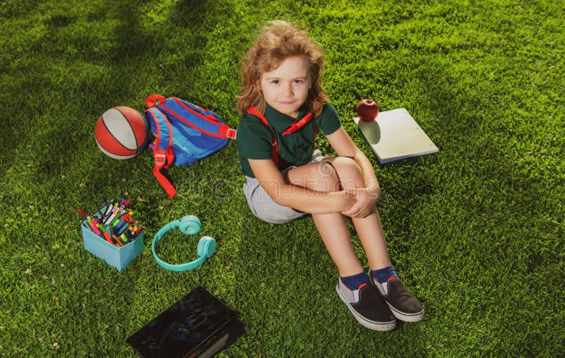 Happy Kid Learn Online in Virtual School Using Tablet on Green Grass ...