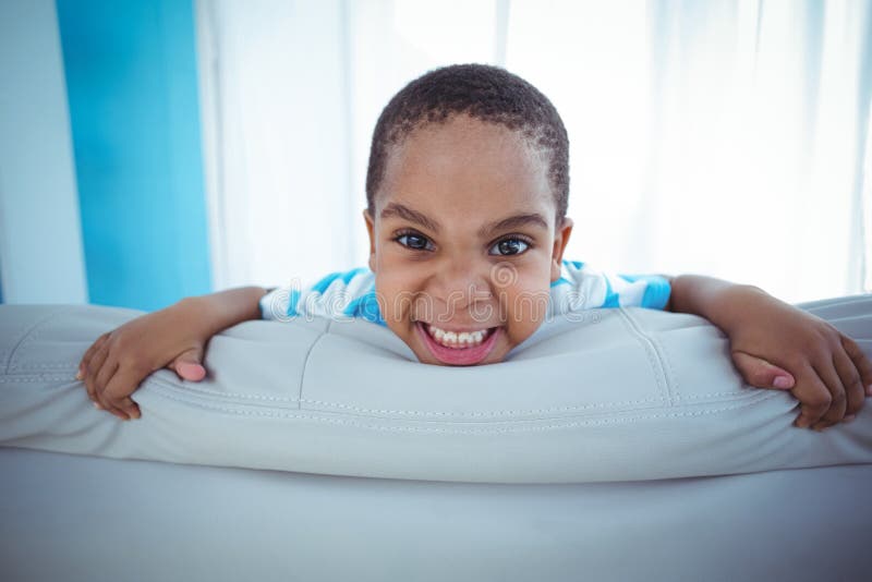 Happy Kid Looking from the Back of the Couch Stock Image - Image of ...