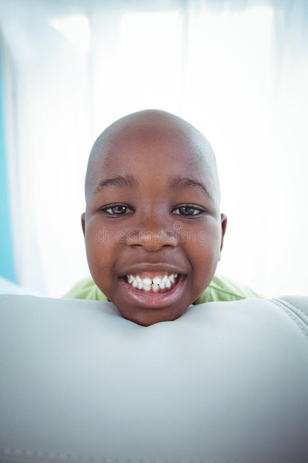 Happy Kid Looking from the Back of the Couch Stock Photo - Image of ...