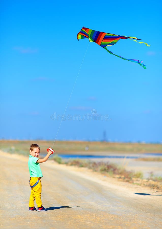 Happy Kid Playing with Kite Stock Photo - Image of person, joyful: 35849022