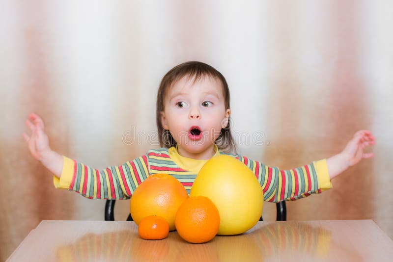 Happy Kid with pomelo stock image. Image of pomelo, baby - 31861279