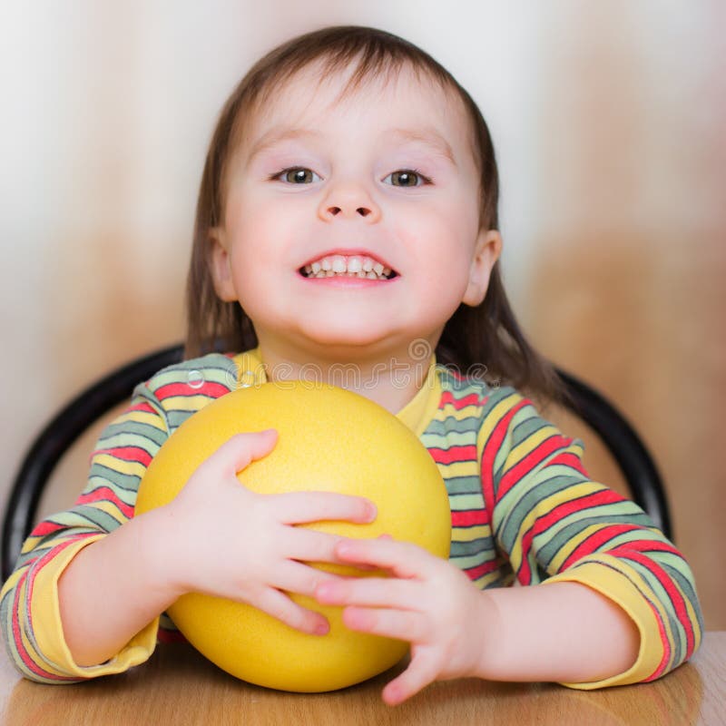 Happy Kid with pomelo stock image. Image of pomelo, baby - 31861279