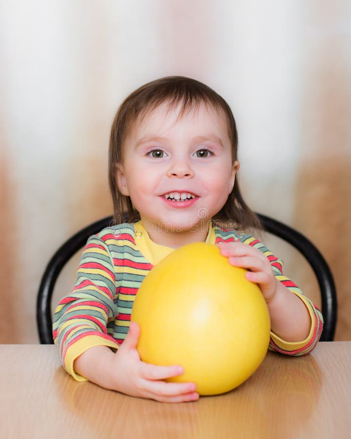 Happy Kid with pomelo stock image. Image of baby, citrus - 31861293