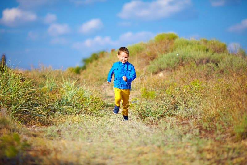 Happy Kid Running the Summer Field Stock Photo - Image of jacket ...