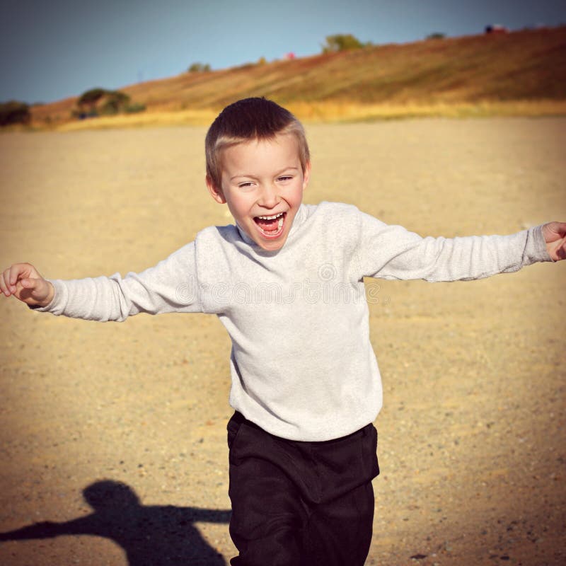 Happy Kid running stock image. Image of spread, attractive - 48258551
