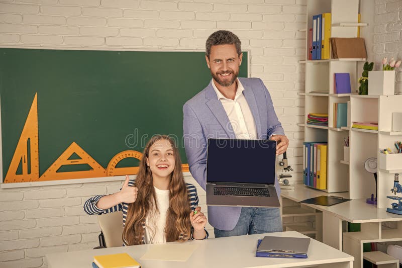 Happy Kid with School Teacher Presenting Laptop Screen with Copy Space ...