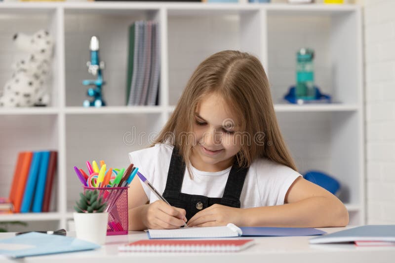 Happy Kid Write in Workbook at School Lesson in Classroom Wear Uniform ...