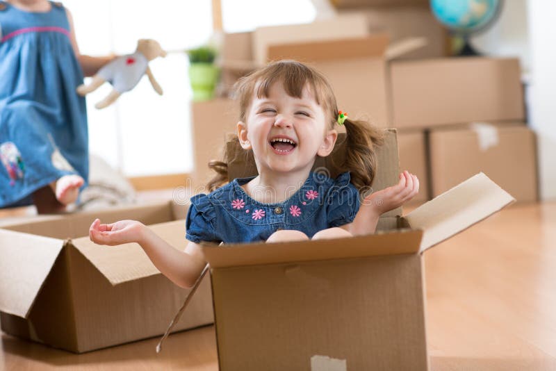 Happy Kids with Boxes at New Home after Moving Stock Image - Image of ...