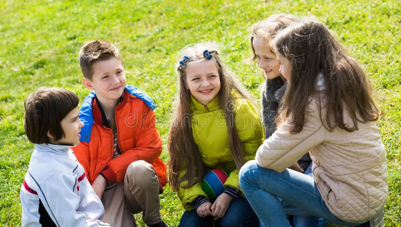 Group Of Children Laughing In Spring Park Stock Image - Image of ...
