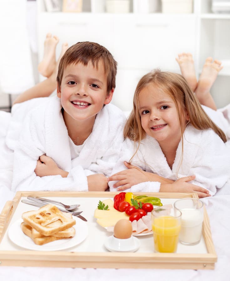 Happy Kids Having Breakfast in Bed Stock Photo - Image of healthy, meal ...