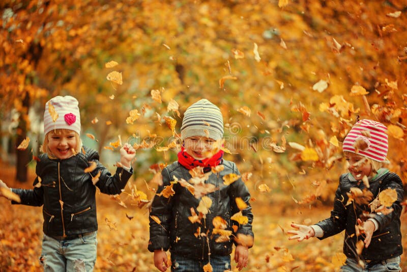 Happy Kids Having Fun with Leaves in Autumn Park Stock Photo - Image of ...