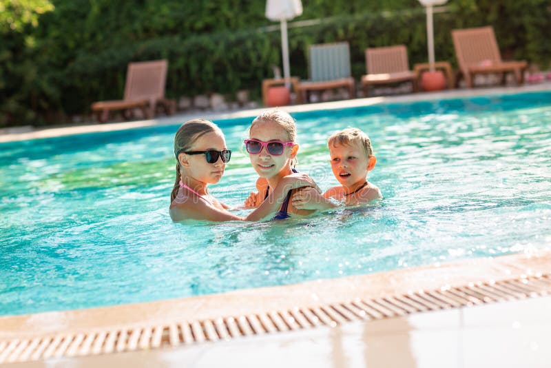 Happy Kids Having Fun at the Pool Stock Image - Image of girl, resort ...