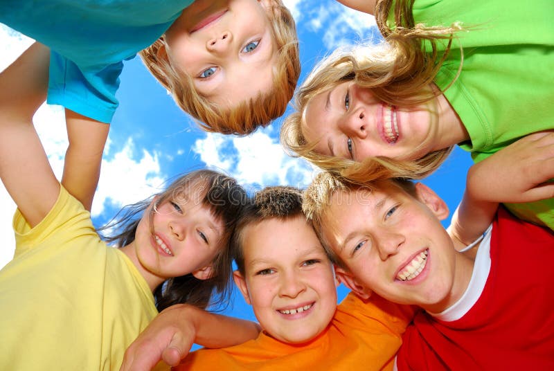 Happy Kids in a Huddle stock image. Image of colorful - 3013321