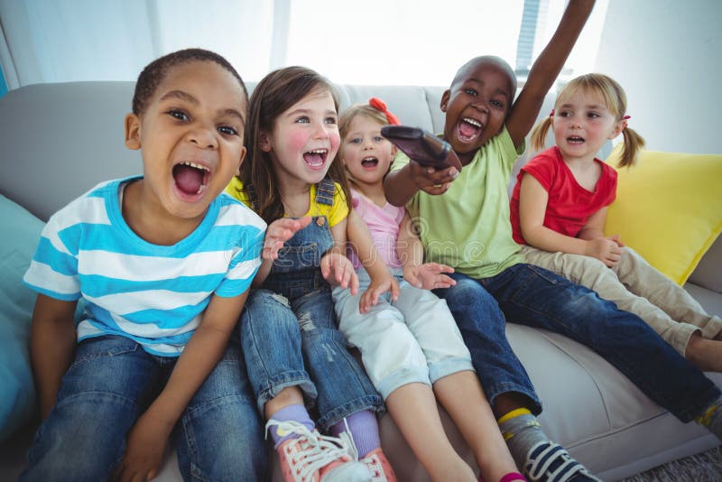 Happy Kids Laughing while Sitting Down Stock Photo - Image of friends ...