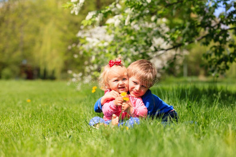 Kids with Wild Spring Flowers Stock Photo - Image of natural, clear ...