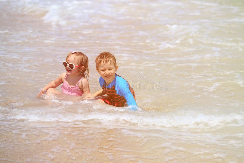 Happy Kids Play with Waves on Beach Stock Image - Image of emotion ...