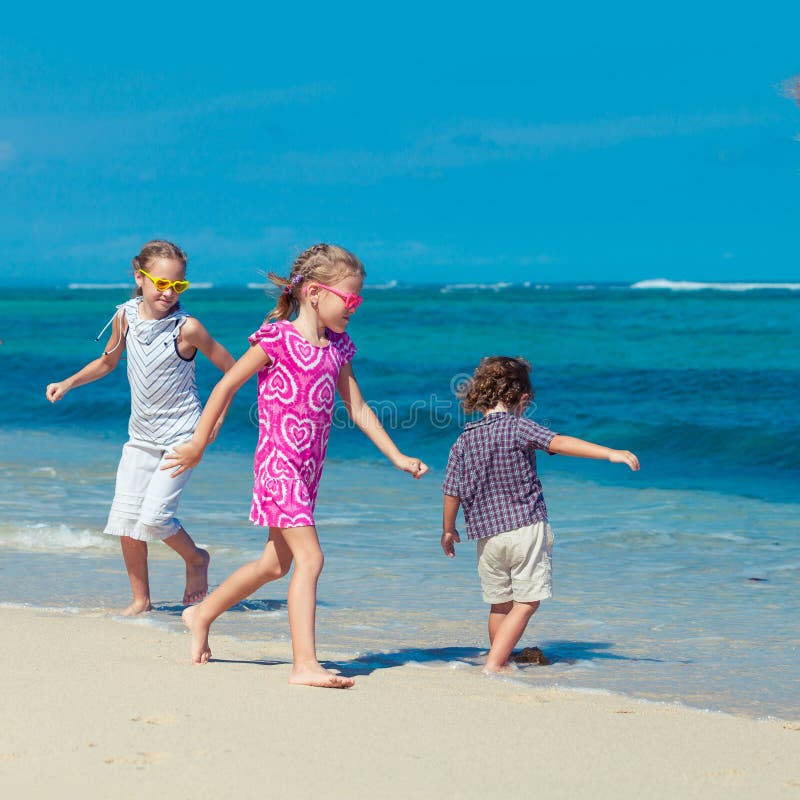 Happy Kids Playing on Beach Stock Image - Image of happy, outdoor: 43502687