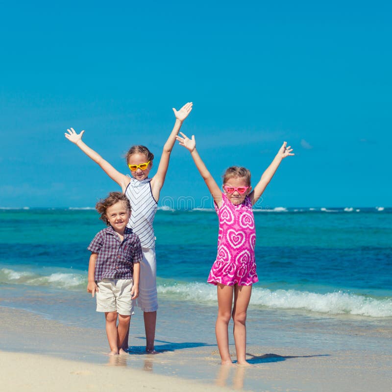 Happy Kids Playing on Beach Stock Image - Image of pulled, family: 43502475