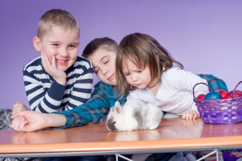 Happy Kids Playing on Easter with Bunny Stock Photo - Image of wooden ...