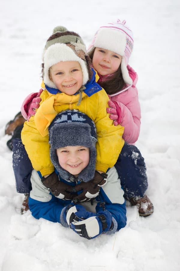 Kids Playing in the Snow stock photo. Image of contented - 1827522