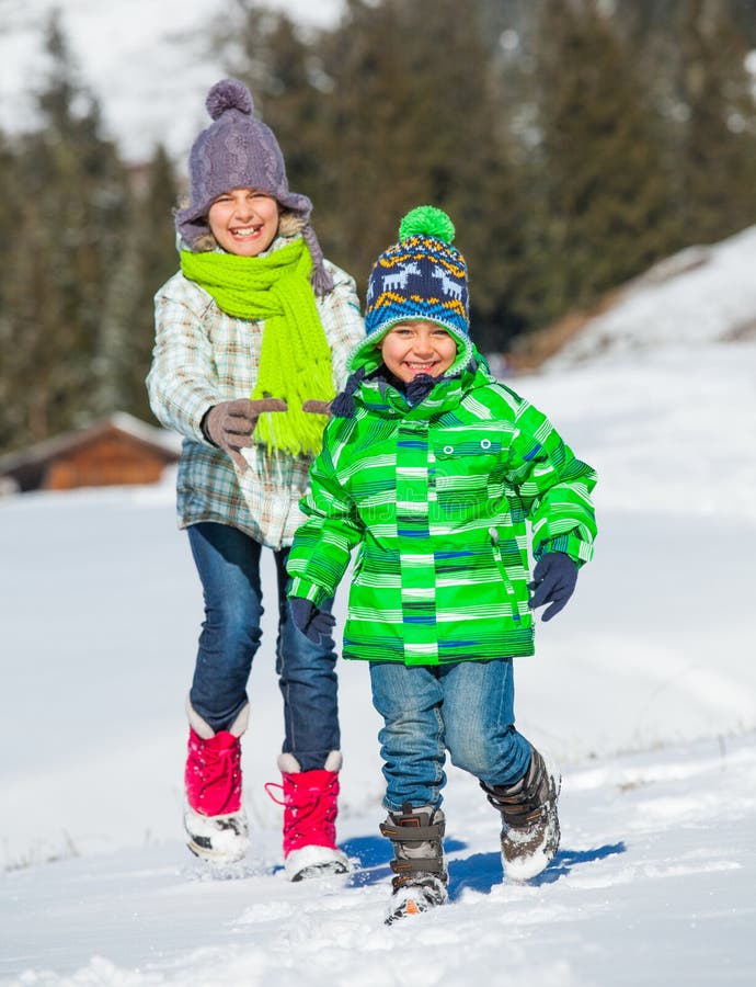 Happy kids playing winter stock image. Image of baby - 46195173