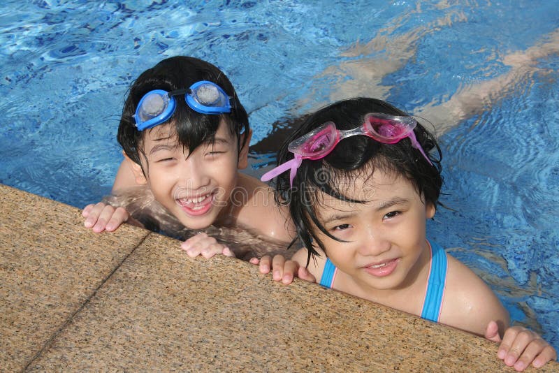 Happy kids in the pool stock image. Image of outdoor - 12650807