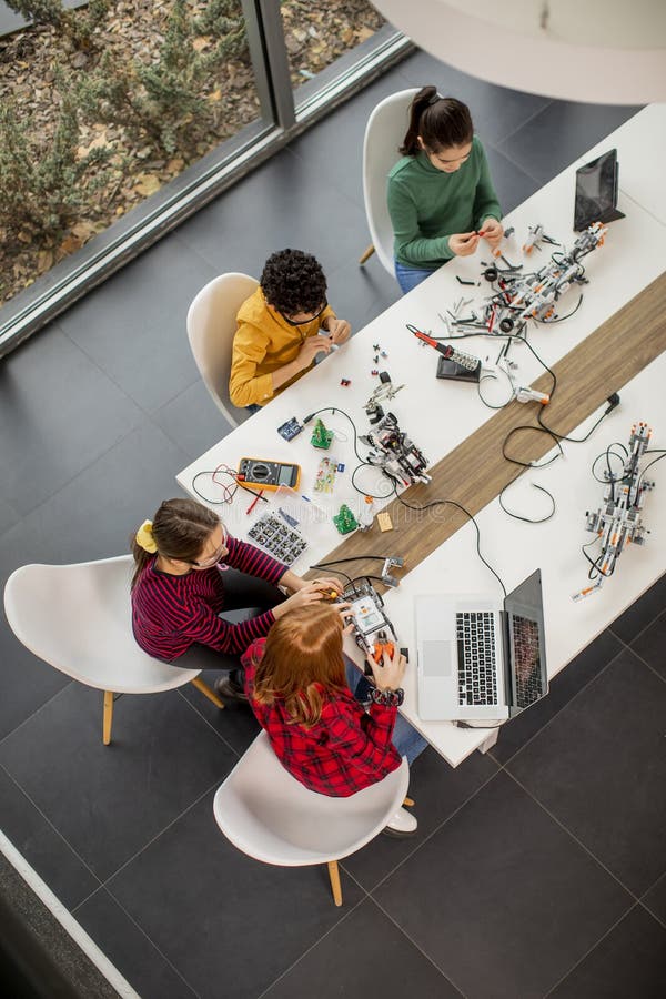 Happy Kids Programming Electric Toys and Robots at Robotics Classroom ...