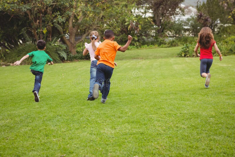 Happy Kids Running Across the Grass Stock Image - Image of grass ...