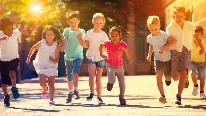 Happy Kids Running in Race in the Street and Laughing Outdoors Stock ... Happy Kids Running in Race in the Street and Laughing Outdoors Stock ...