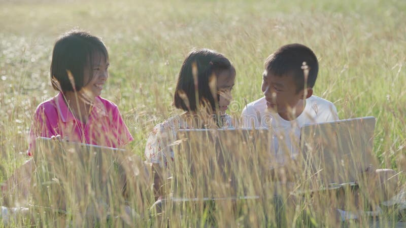 Happy Kids Smiling and Learning on Grass Field Stock Footage - Video of ...