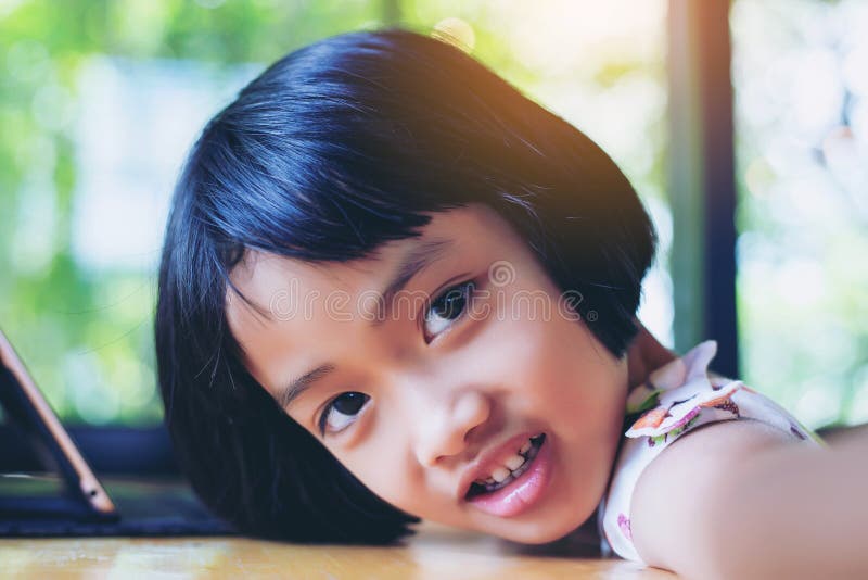 Happy Kids Using a Laptop Computer at Home Stock Photo - Image of ...