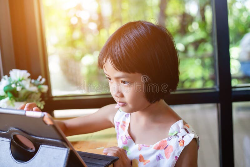 Happy Kids Using a Laptop Computer at Home Stock Photo - Image of ...