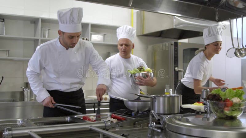 Happy Kitchen Crew with Chef Singing and Dancing while Cooking Stock ...