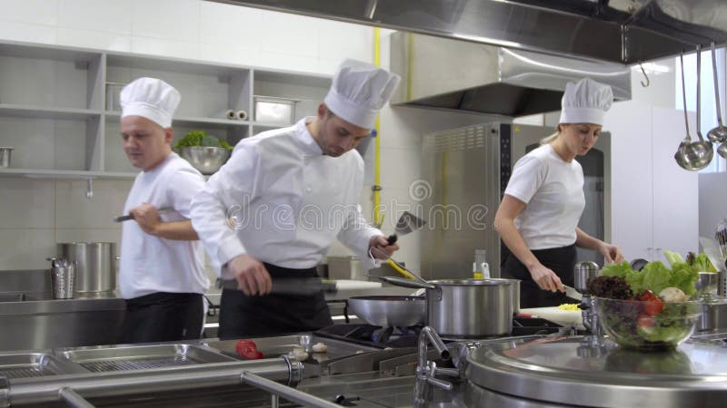 Happy Kitchen Crew with Chef Singing and Dancing while Cooking Stock ...