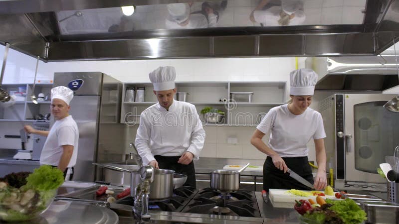 Happy Kitchen Crew with Chef Singing and Dancing while Cooking Stock ...