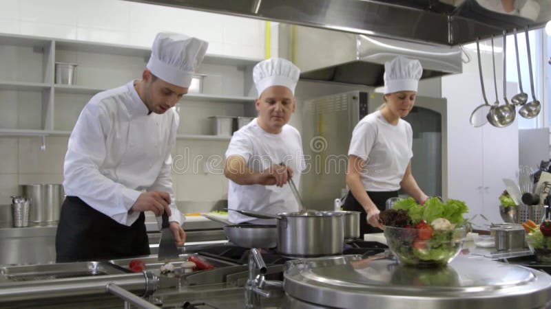 Happy Kitchen Crew with Chef Singing and Dancing while Cooking Stock ...